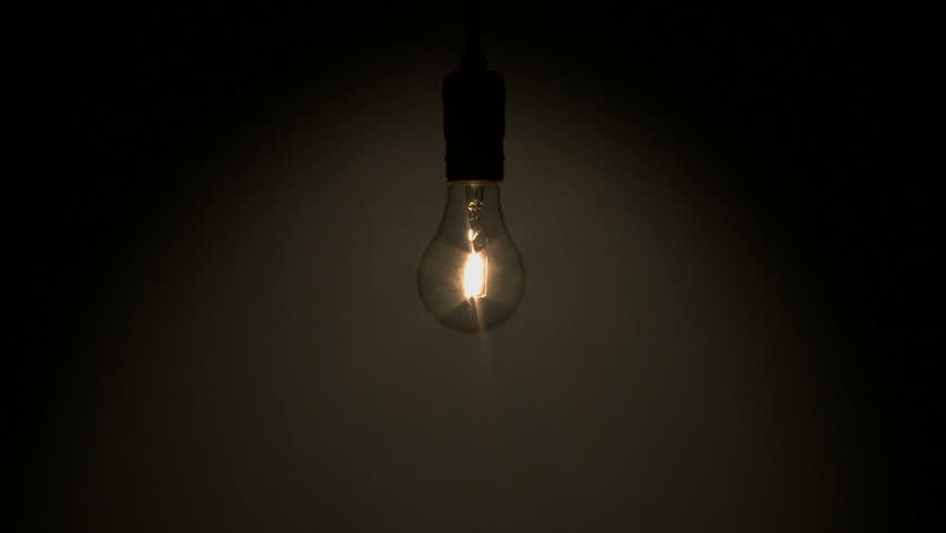 A Hanging, Dimmed Light Bulb, 3 Bulbs In The Background. WARM Mood ...