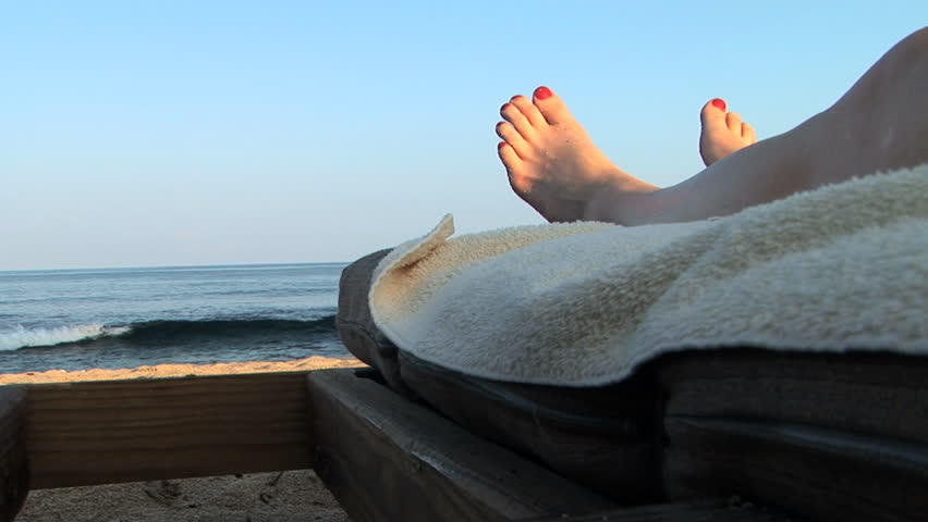 Back View Of A Teenage Girl Laying Down On A White Sand Beach Watching ...