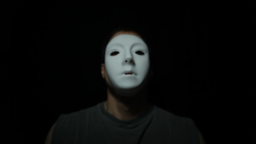 Masked man over black background için Stok Video Klip | Shutterstock