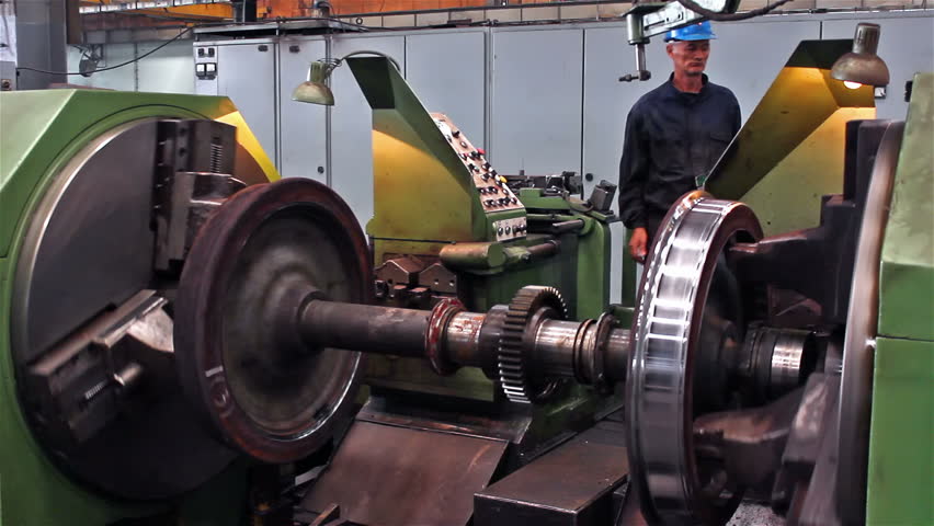 Worker On A Machine, Metal Working Lathe A In Factory. Machining ...