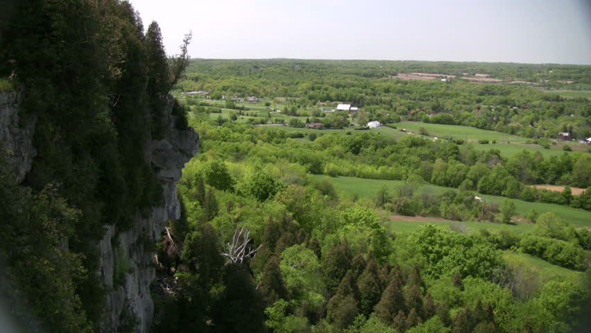 Stock video of a rocky cliff overlooks the grassy | 44848 | Shutterstock