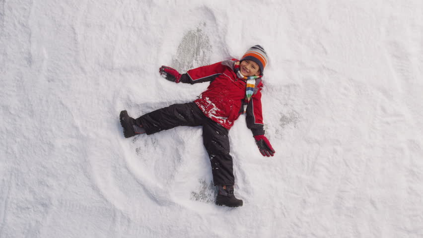 Young Boy Making Snow Angel Stock Footage Video (100% Royalty-free ...