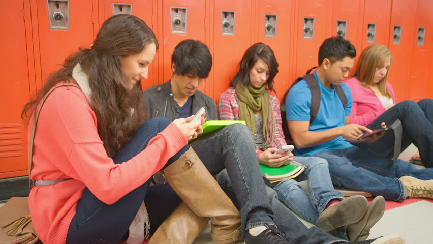 Group Of Students Sitting On Floor And Listening To Off Camera Teacher ...