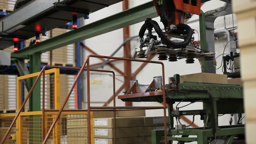 Stock video of automatic robotic arm lifting and transporting | 4994678 ...