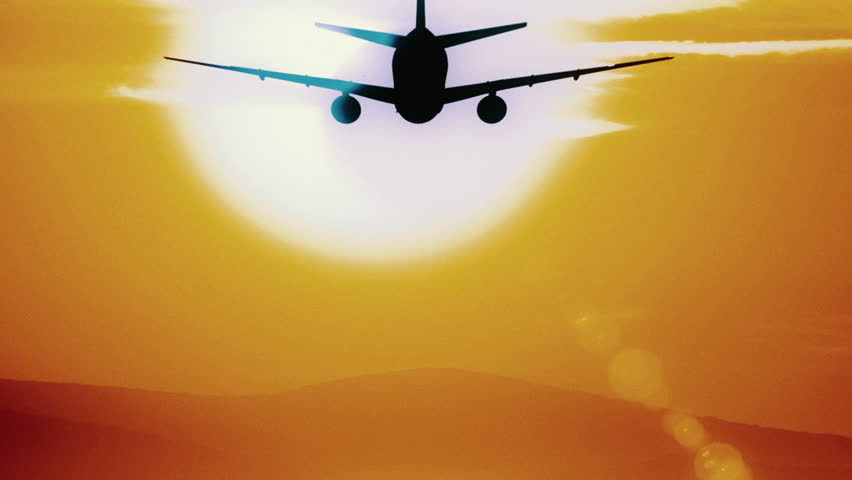 Stock video of plane flying off into the sunset | 5490368 | Shutterstock