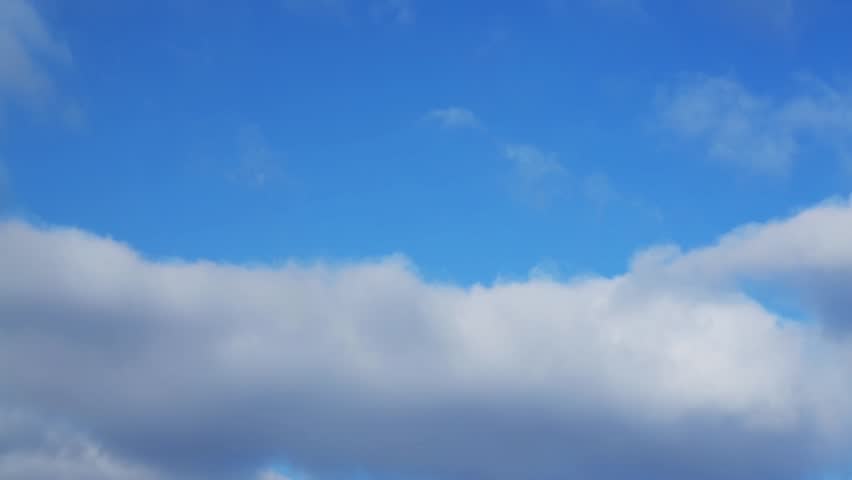 One Minute Long Loop Features White Clouds Floating Through A Deep Blue ...