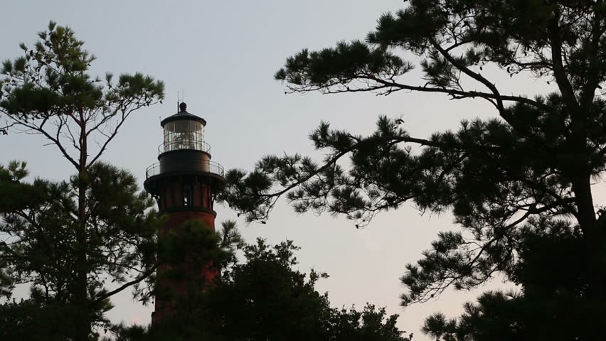 Currituck Lighthouse Of Corolla, North Carolina With Pink Wild Flowers ...