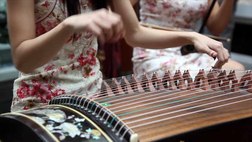 Chinese Traditional Musician Playing Chinese Guzheng.Guzheng, Also ...