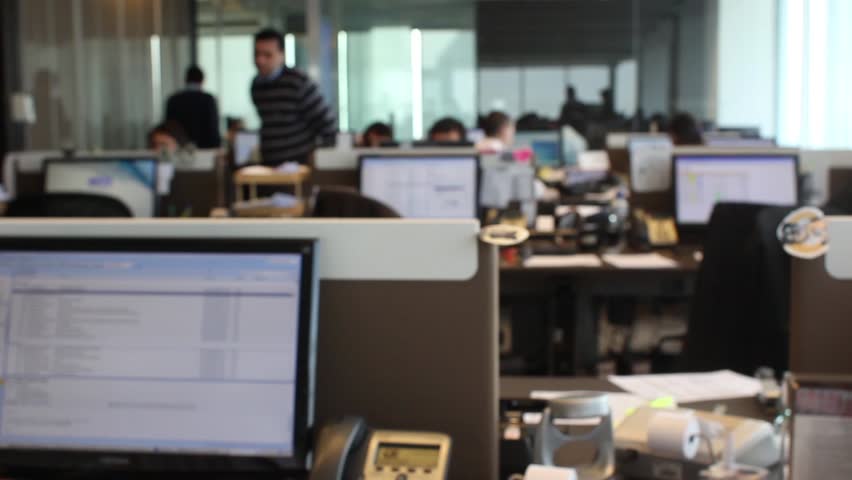 A Journalist Working On A Computer In Newsroom. Blur Background Stock ...