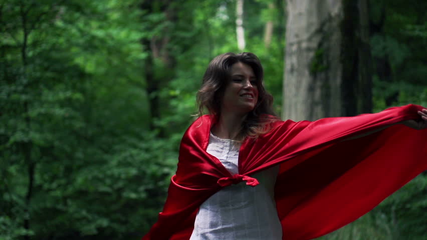 Stock video of happy woman in red cape turning | 7334338 | Shutterstock