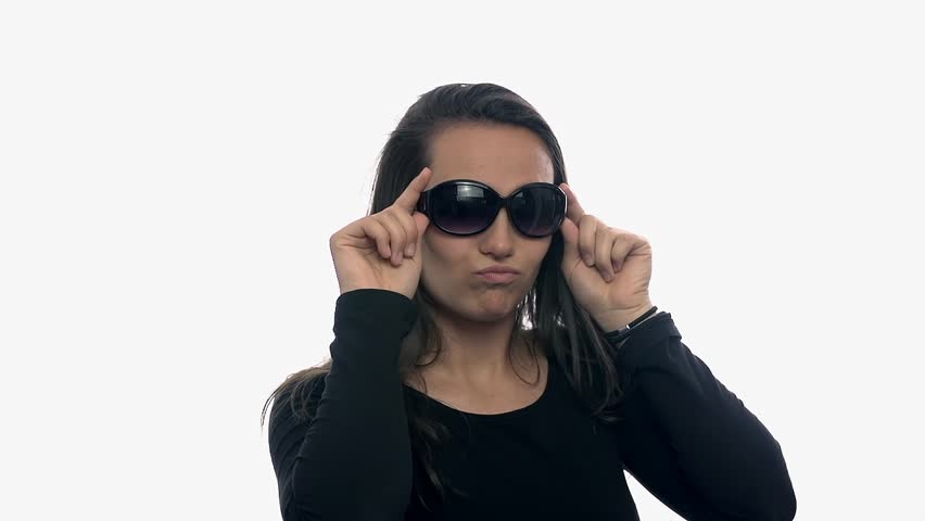 Stock video of attractive young woman winking behind sunglasses ...