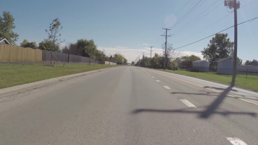 4k Car Driving Down Road Looking Out Back Window In Residential ...