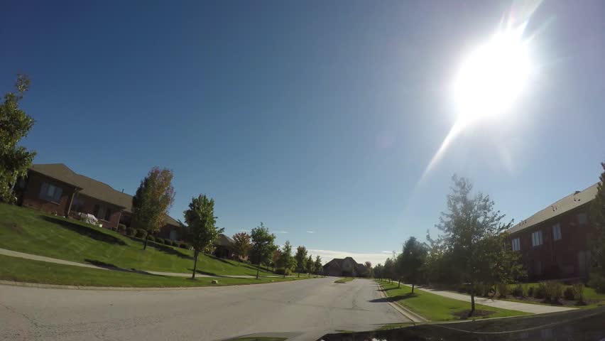 4k Car Driving Down Road Looking Out Back Window In Residential ...