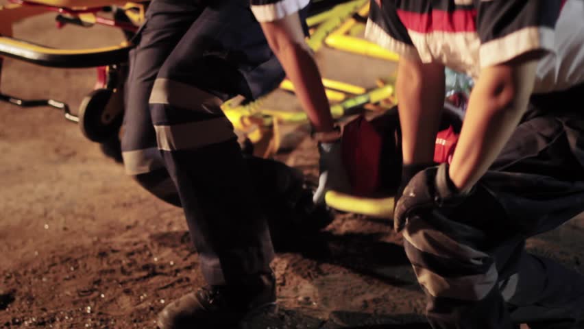 Stock video of paramedics helps an injured woman moving | 7708798 ...