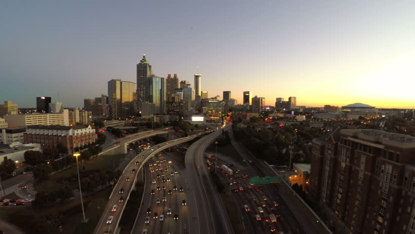 Stock Video Clip of Atlanta cityscape aerial flying over freeway during ...