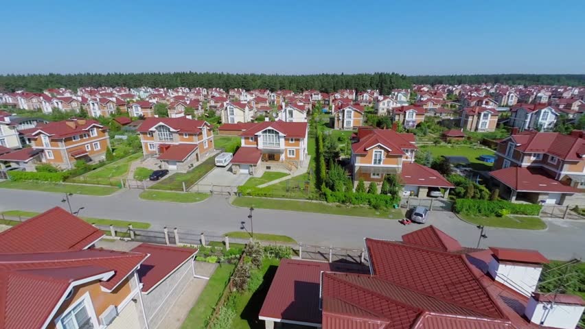 AERIAL: Flying Above Lush Treetops Towards Luxury Suburban Town ...