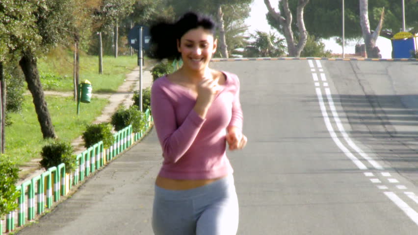 Stock video of medium shot of beautiful girl jogging | 8328898 ...