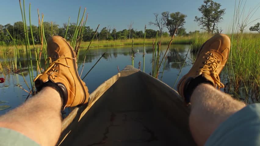 Stock video of first person view kayaking/canoeing through clear ...