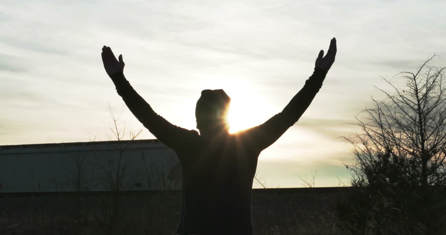 Stock Video Clip of Man Hands Lifted Up with Sunset | Shutterstock