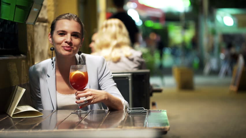 Stock video of happy woman raising toast to camera | 9039778 | Shutterstock