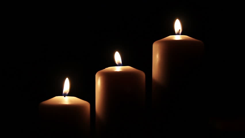 This Is A Seamless Loop Of 3 Warm Candles Gently Burning In A Black ...