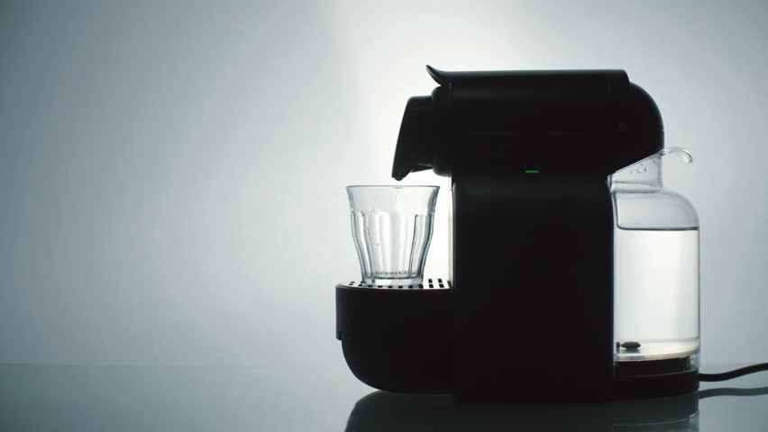 Nespresso Coffee Maker Making Cup Of Coffee/espresso In Small Glass ...