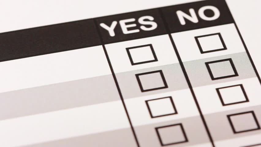 Hand Filling Yes And No At The Checklist Box. Close Up. Survey And Poll ...