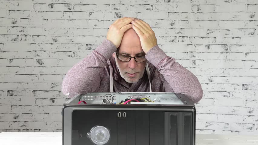 Angry Technician Pulling Wires In Broken Computer In His Office Stock ...